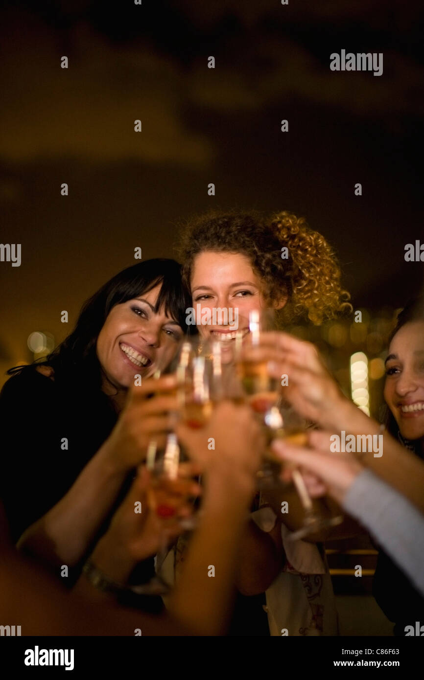 People toasting at party at night Stock Photo - Alamy