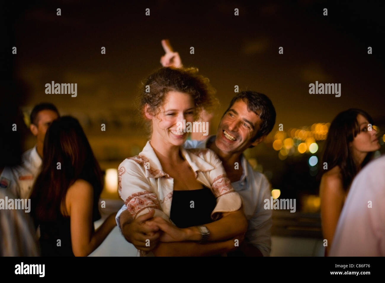 Couple dancing at party at night Stock Photo - Alamy