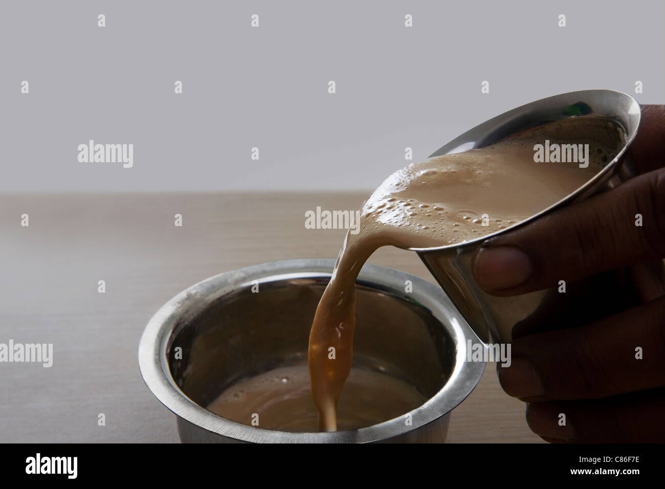 Filter coffee being poured into a dabarah Stock Photo - Alamy