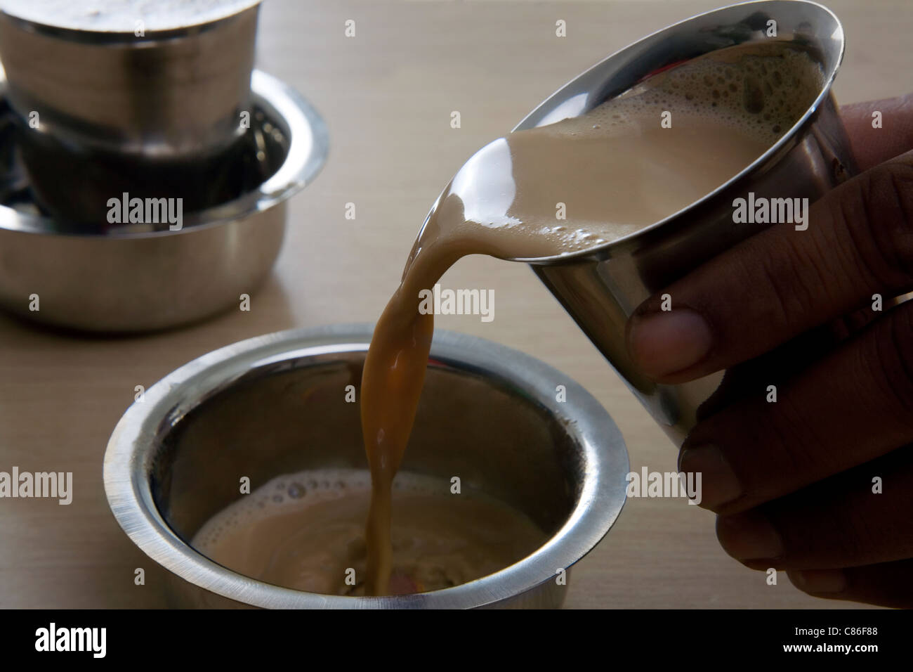 Filter coffee being poured into a dabarah Stock Photo - Alamy