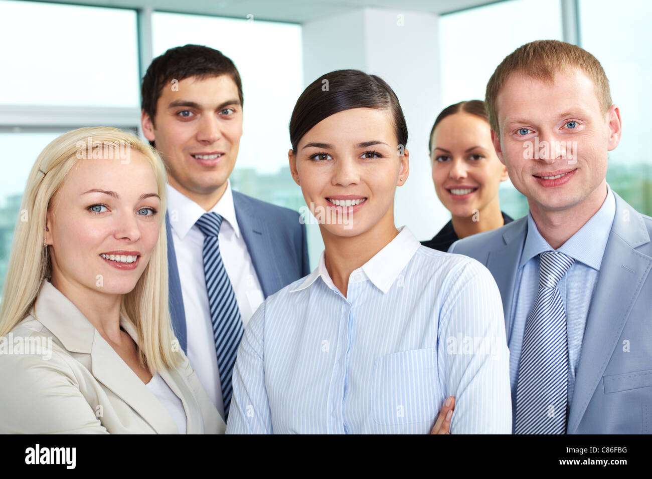 Portrait of young business people looking at camera and smiling Stock ...