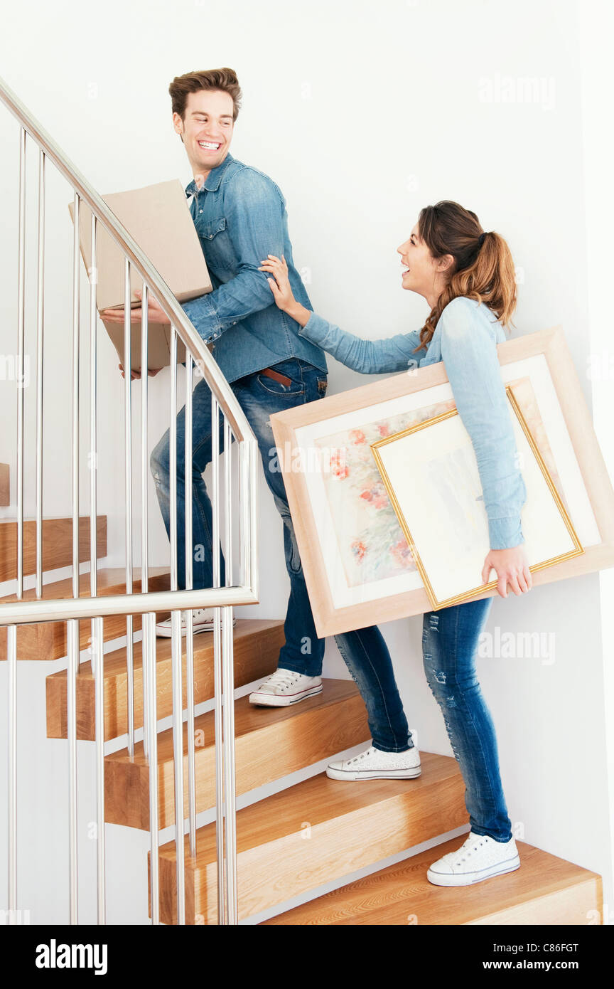 Two men moving box hi-res stock photography and images - Alamy