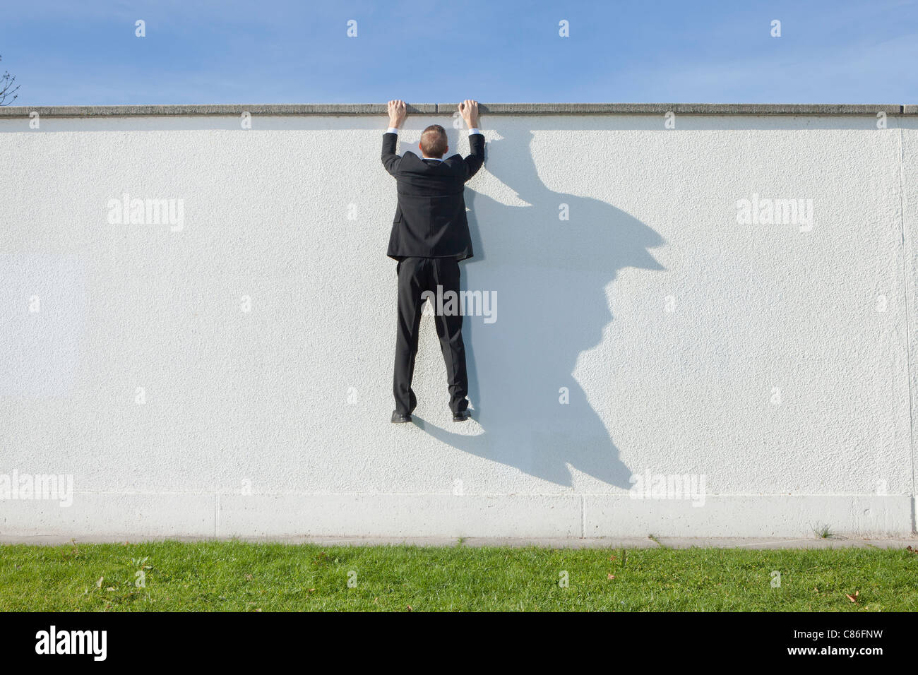 Climbing over wall hi-res stock photography and images - Alamy