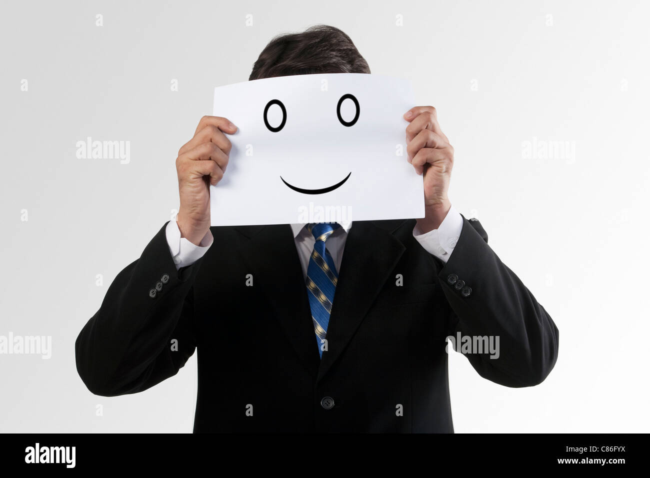 Businessman hiding his face Stock Photo - Alamy