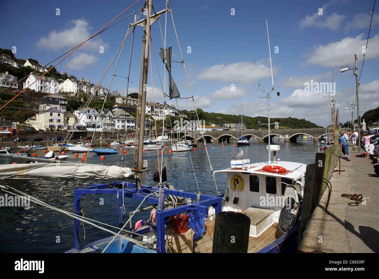Quayside view of the River Looe passing through the popular resort of ...