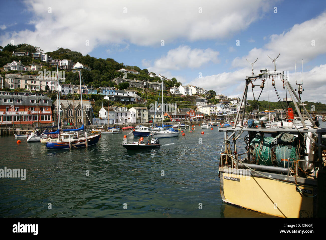 Quayside view of the River Looe passing through the popular resort of ...