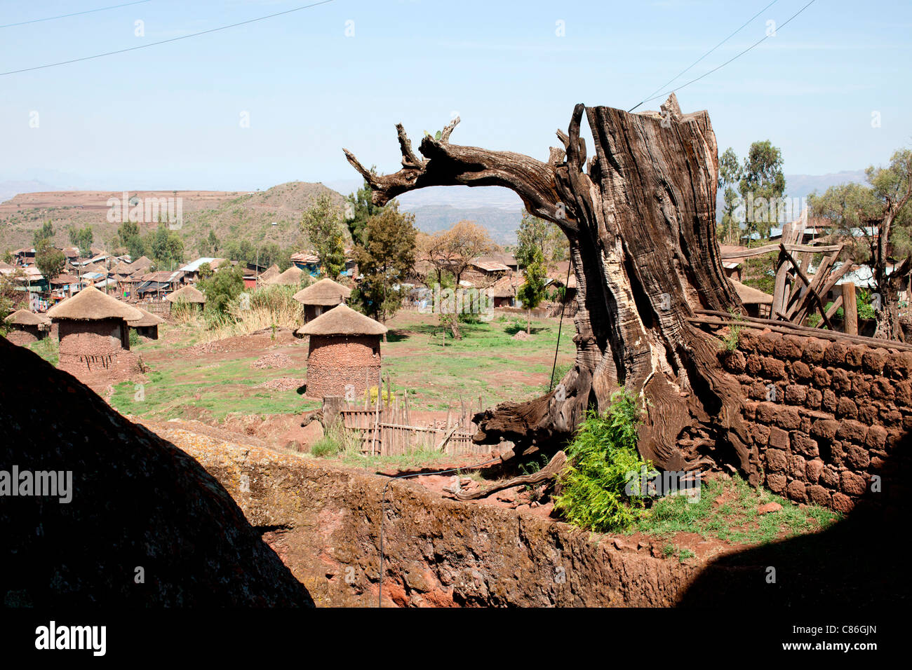 Traditional stone built thatched tukuls around the rock-hewn churches ...