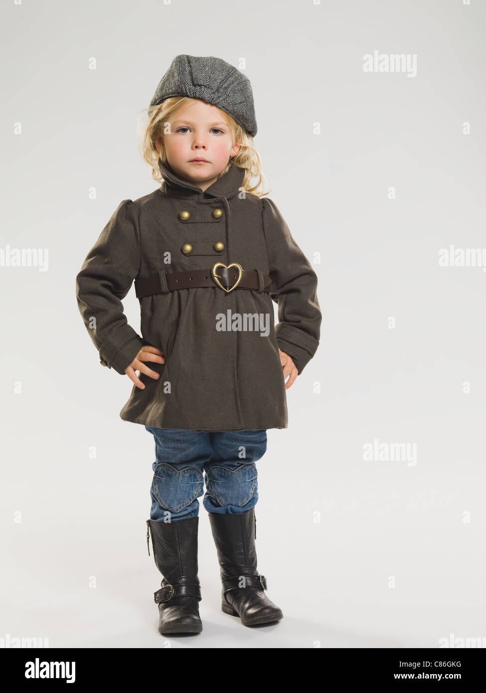 Girl wearing coat and rainboots Stock Photo - Alamy
