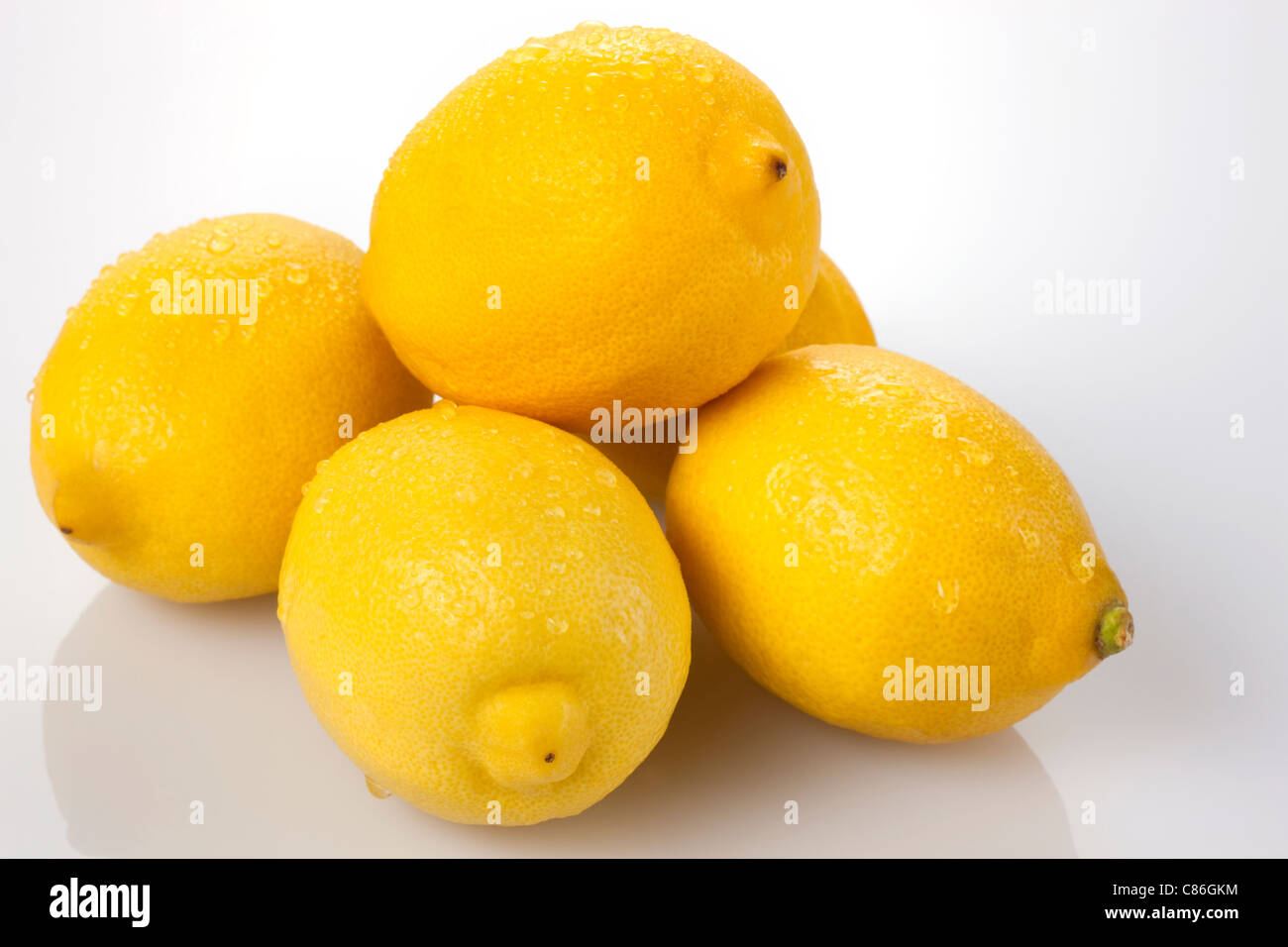 Wet Lemons on White Background Stock Photo - Alamy