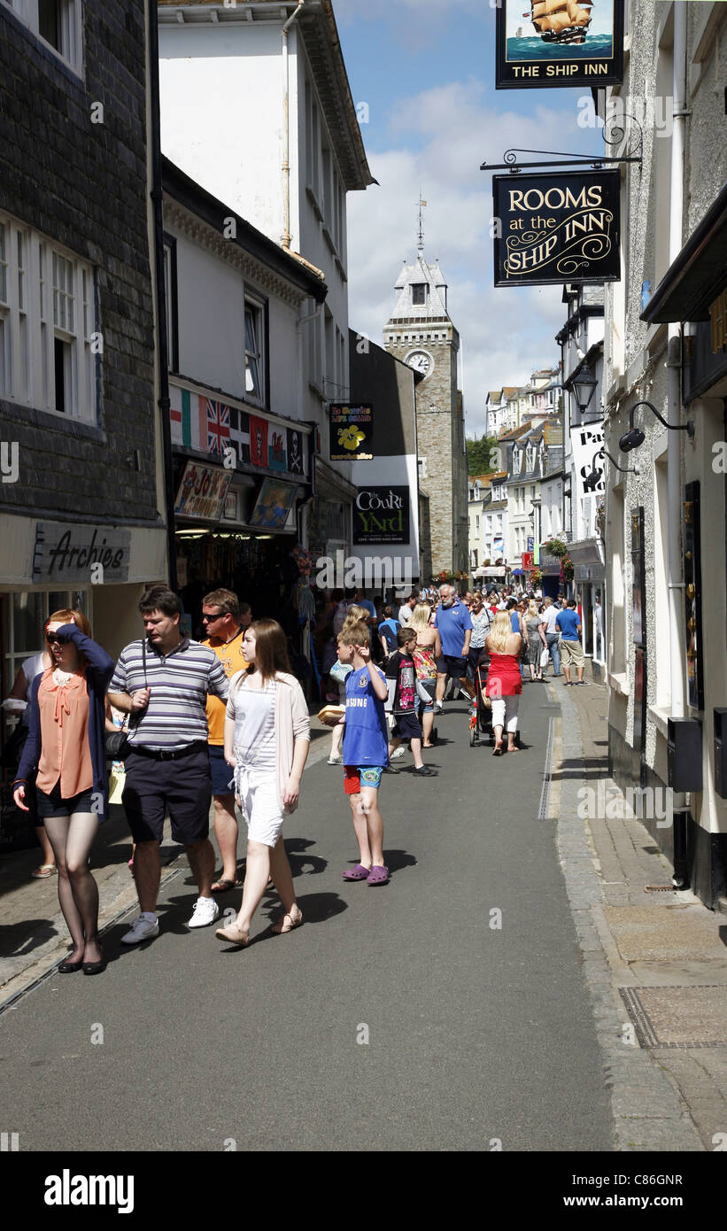 The narrow main shopping street in the south Cornish resort of Looe ...