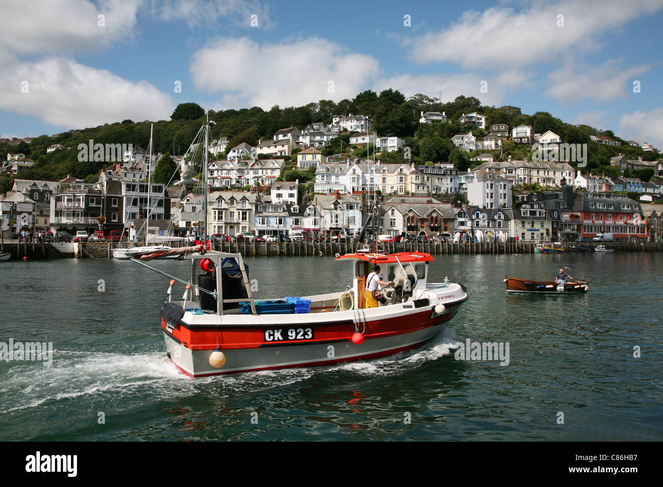Fishing boat returning to the port of Looe a popular resort of Looe on ...