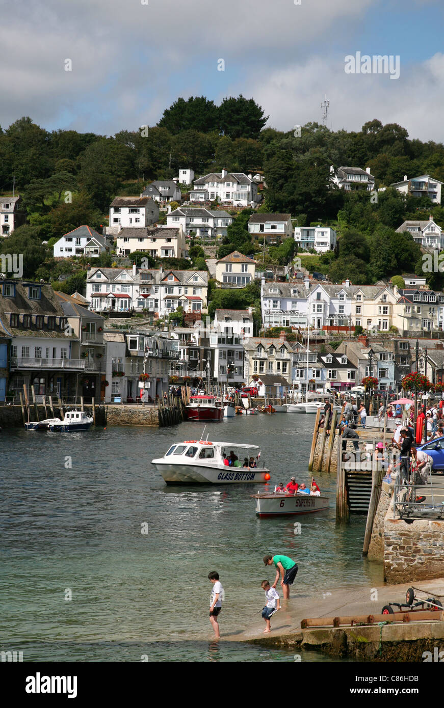 Quayside view of the River Looe passing through the popular resort of ...