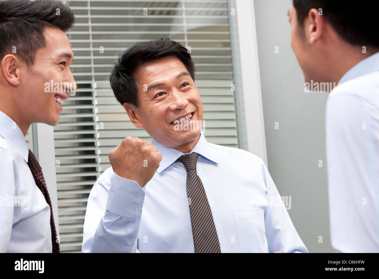 Colleagues Talking Together Stock Photo - Alamy