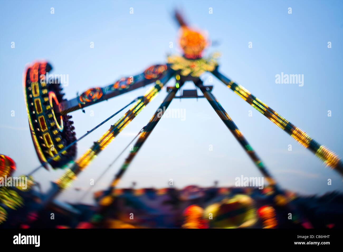Amusement park ride against blue sky Stock Photo - Alamy