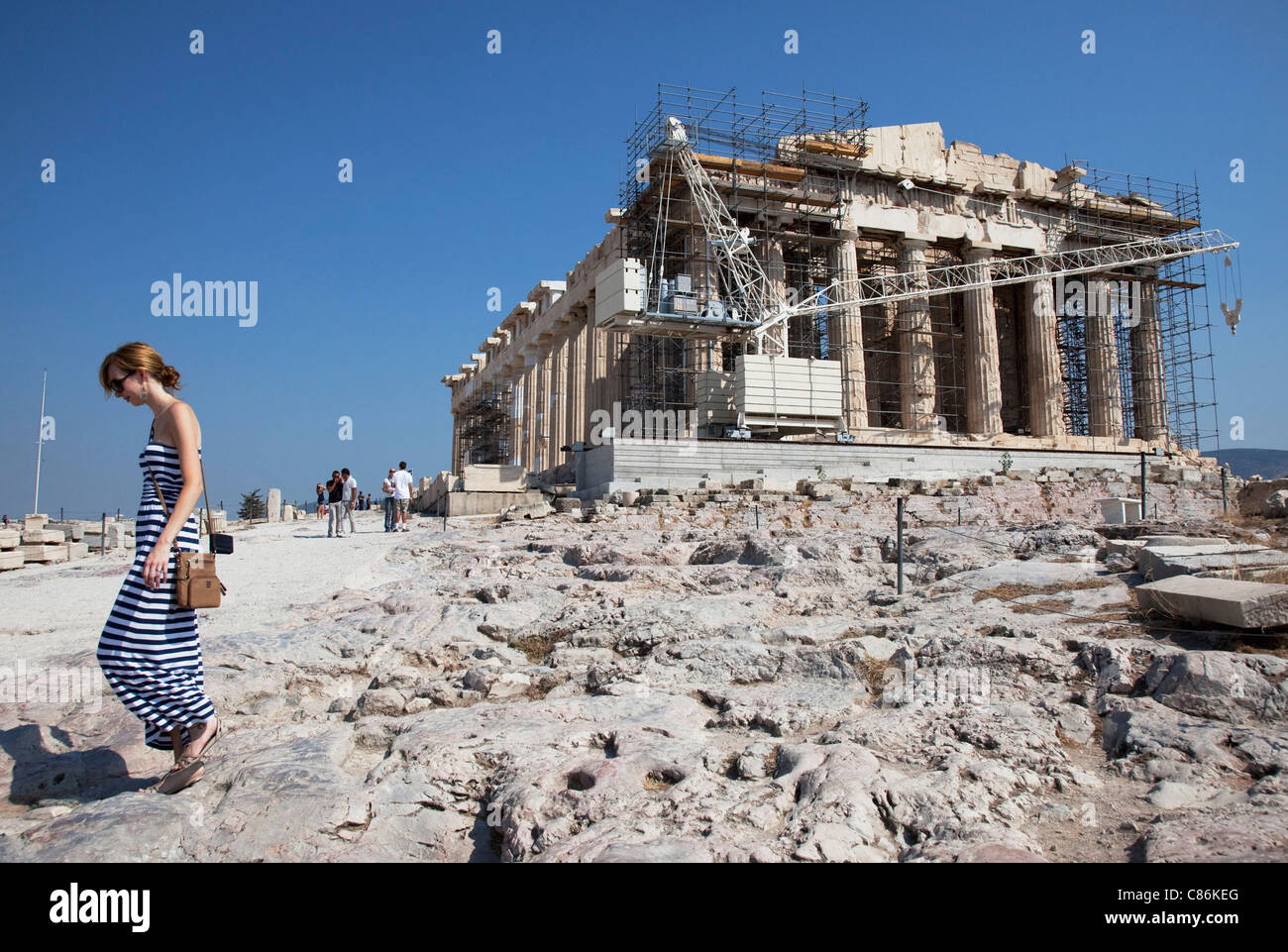 Tourists and visitors at the ancient Greek temples at Acropolis of ...
