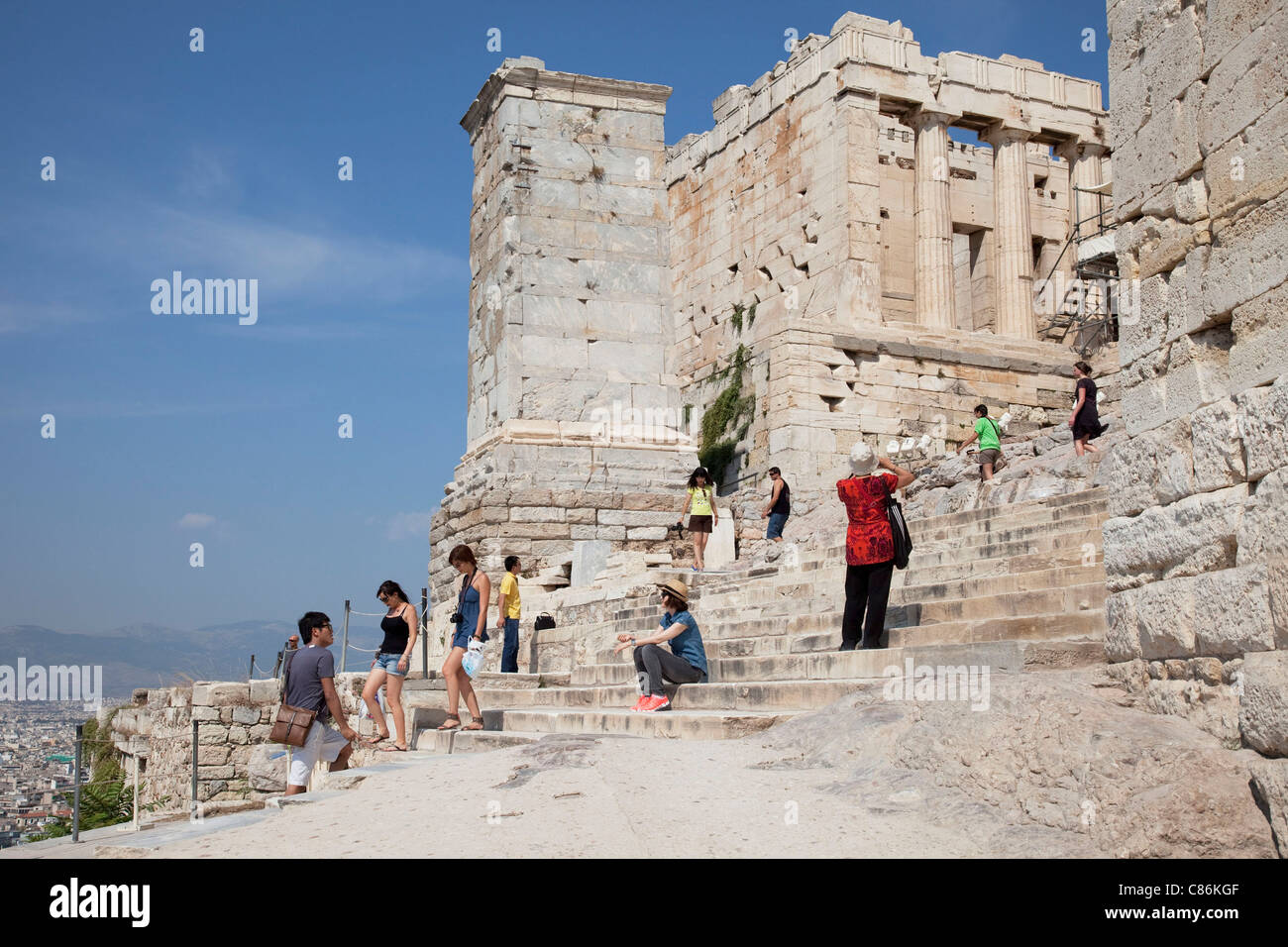 Tourists and visitors at the ancient Greek temples at Acropolis of ...