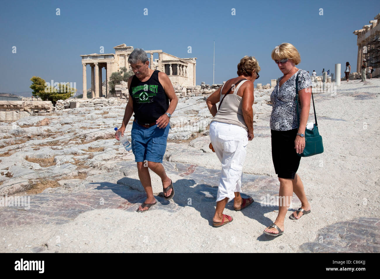 Tourists and visitors at the ancient Greek temples at Acropolis of ...