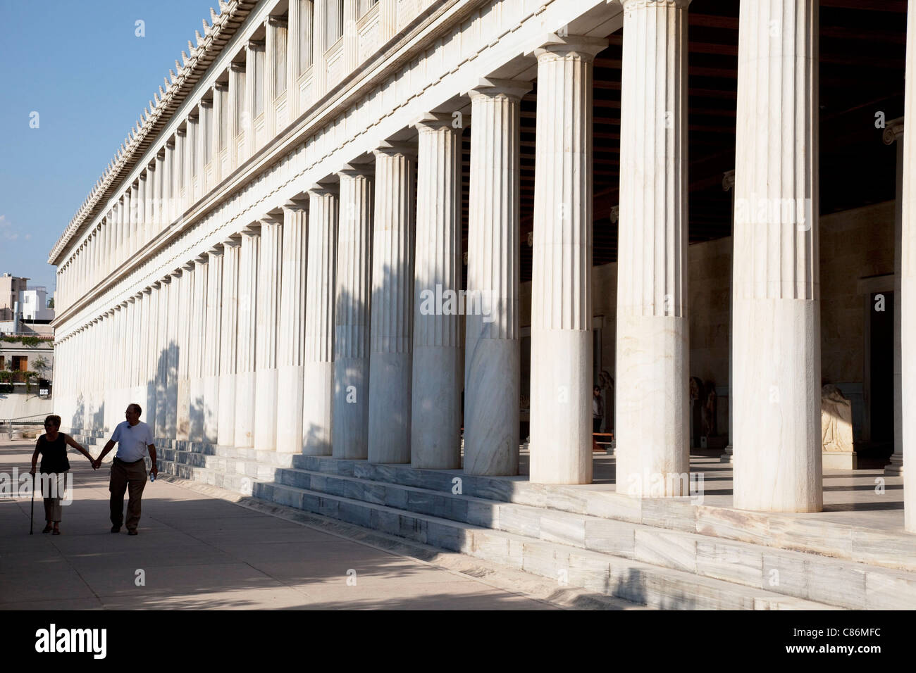 Elderly couple at The Stoa of Attalos or Attalus located in the east ...