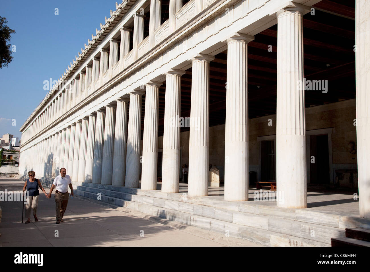 Elderly couple at The Stoa of Attalos or Attalus located in the east ...