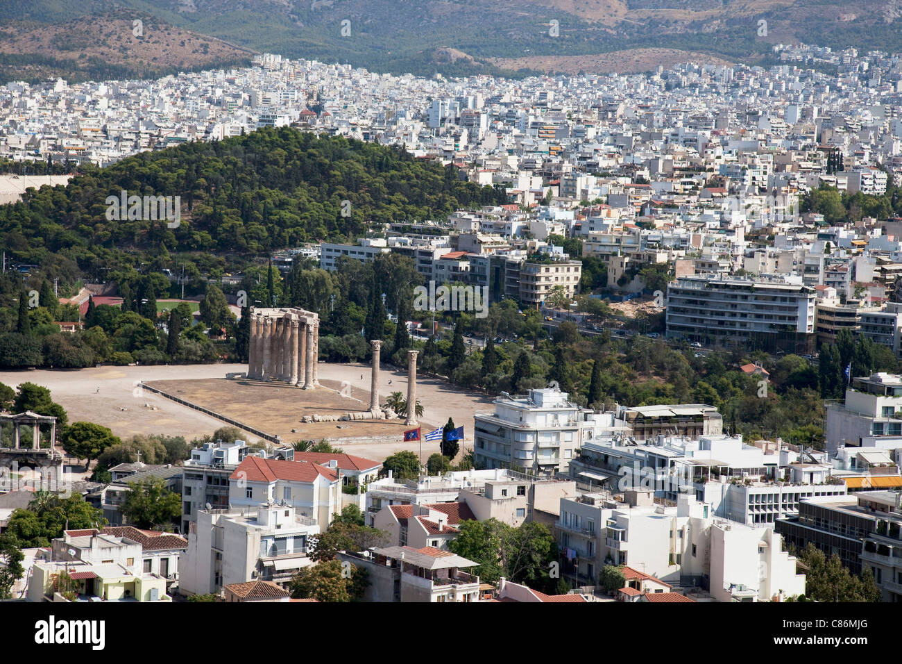 View across the sprawling city of Athens from Acropolis over Temple of ...