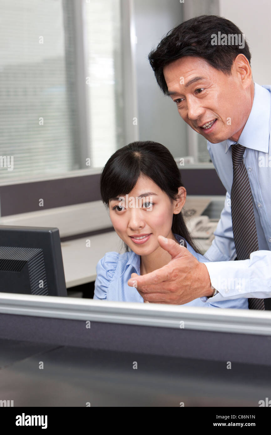 Colleague Helping Co-Worker Stock Photo - Alamy
