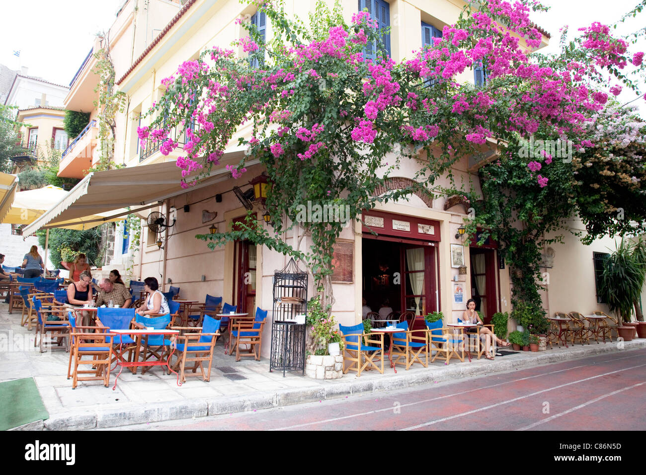 Street taverna scene in Plaka. Plaka is the old historical neighborhood ...