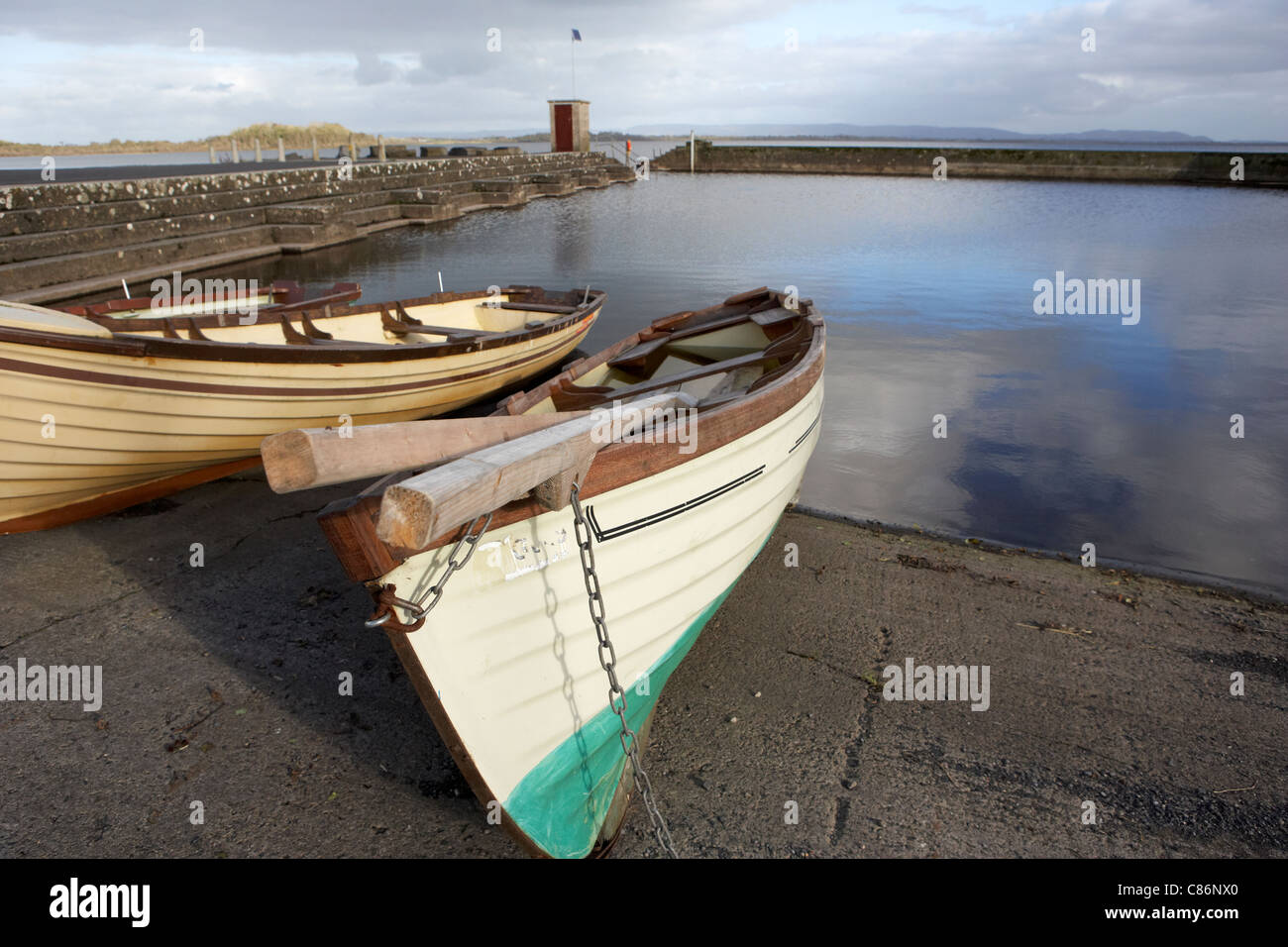row fishing boats in the gortnor abbey harbour at gortnaraby in lough ...