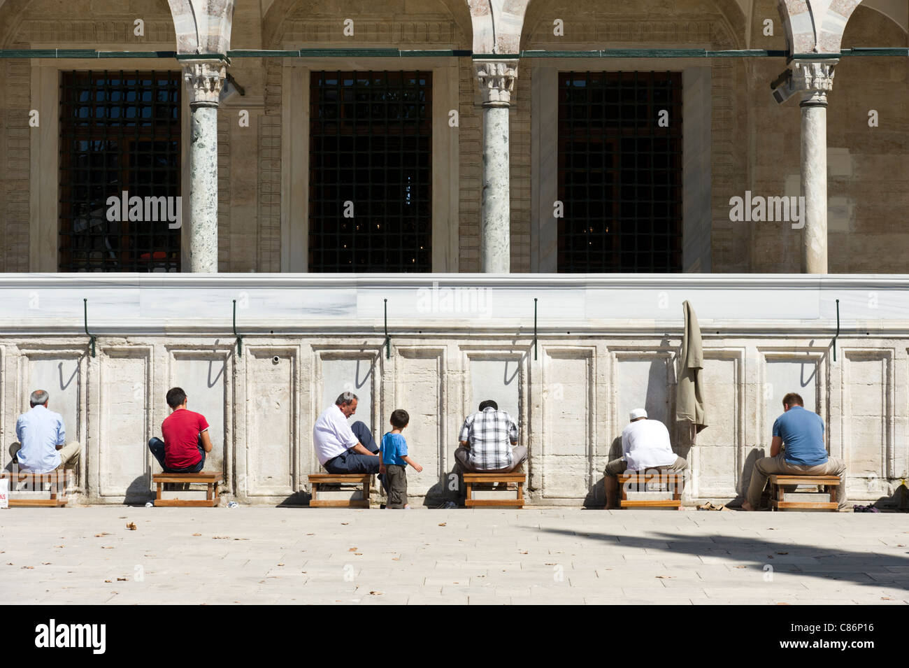 Muslim men washing their feet before praying at Suleymaniye Mosque ...