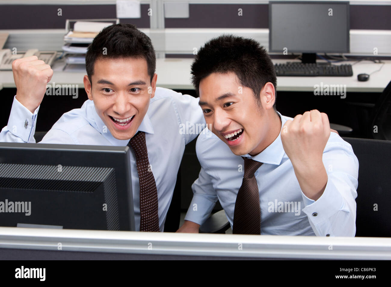 Two Businessmen Cheering Stock Photo - Alamy