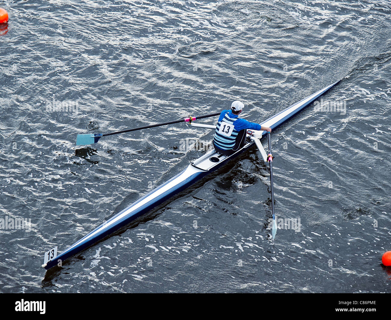 Young men rowing boat hi-res stock photography and images - Alamy