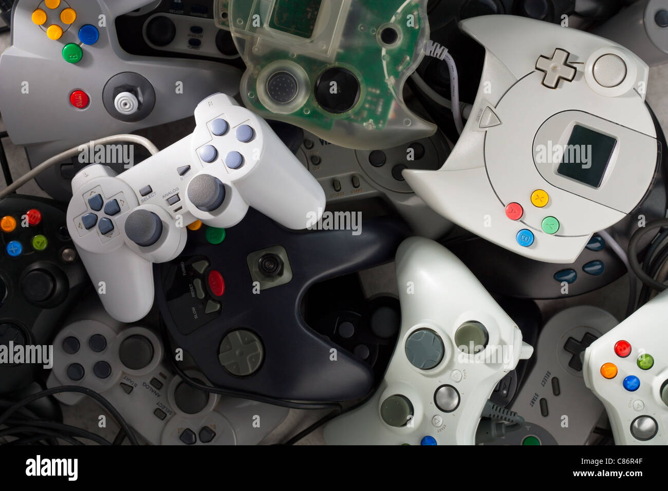 Scattered Videogames Gamepads of Many Types Stock Photo - Alamy