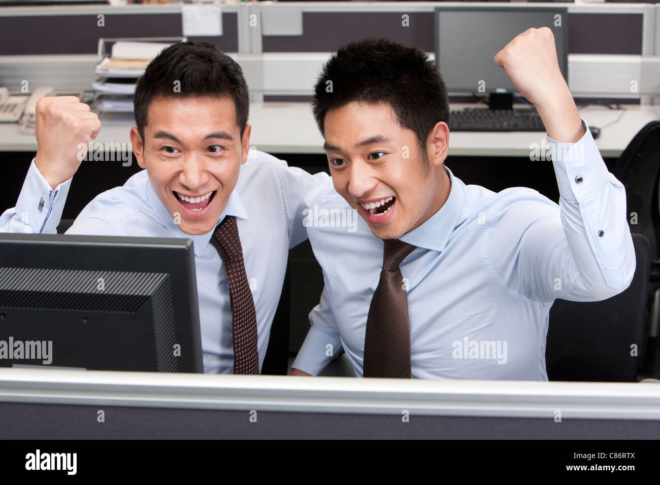 Two Businessmen Cheering Stock Photo - Alamy