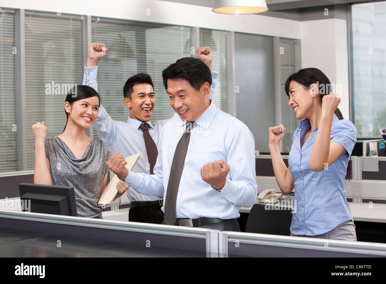 Colleagues Cheering Together Stock Photo - Alamy