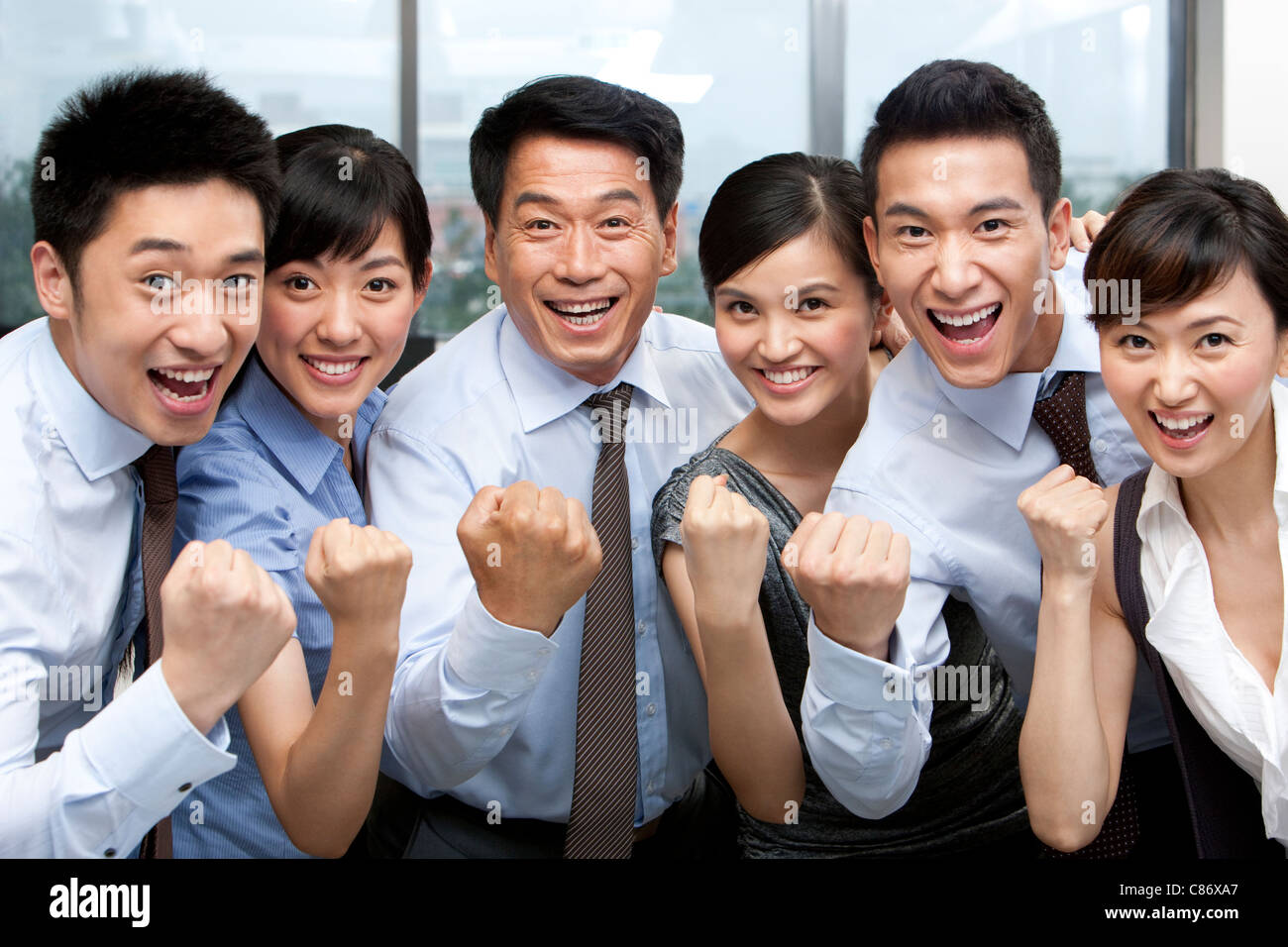 Colleagues Cheering Together Stock Photo - Alamy