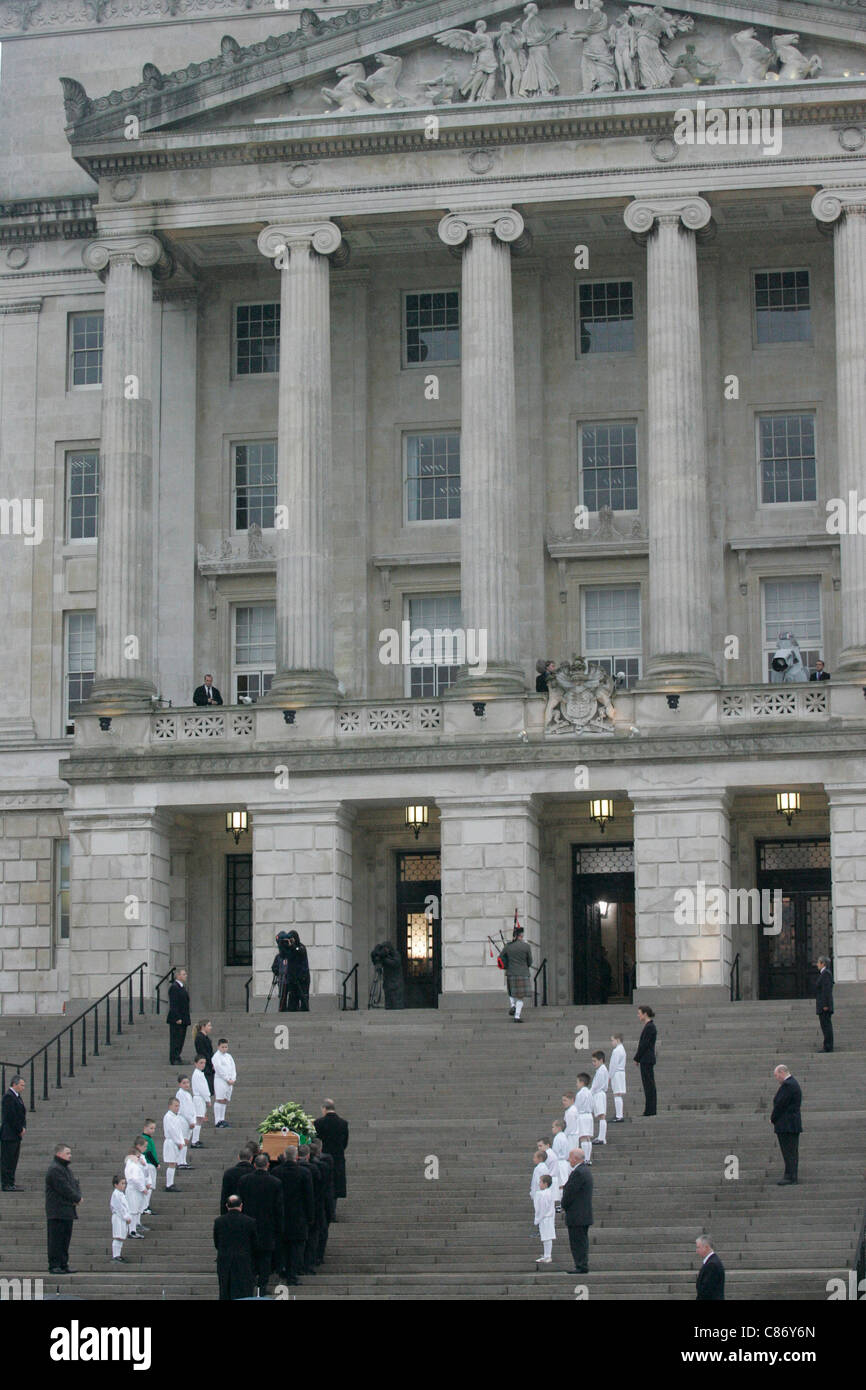 George Bests coffin is carried up the steps of Parliament Buildings ...