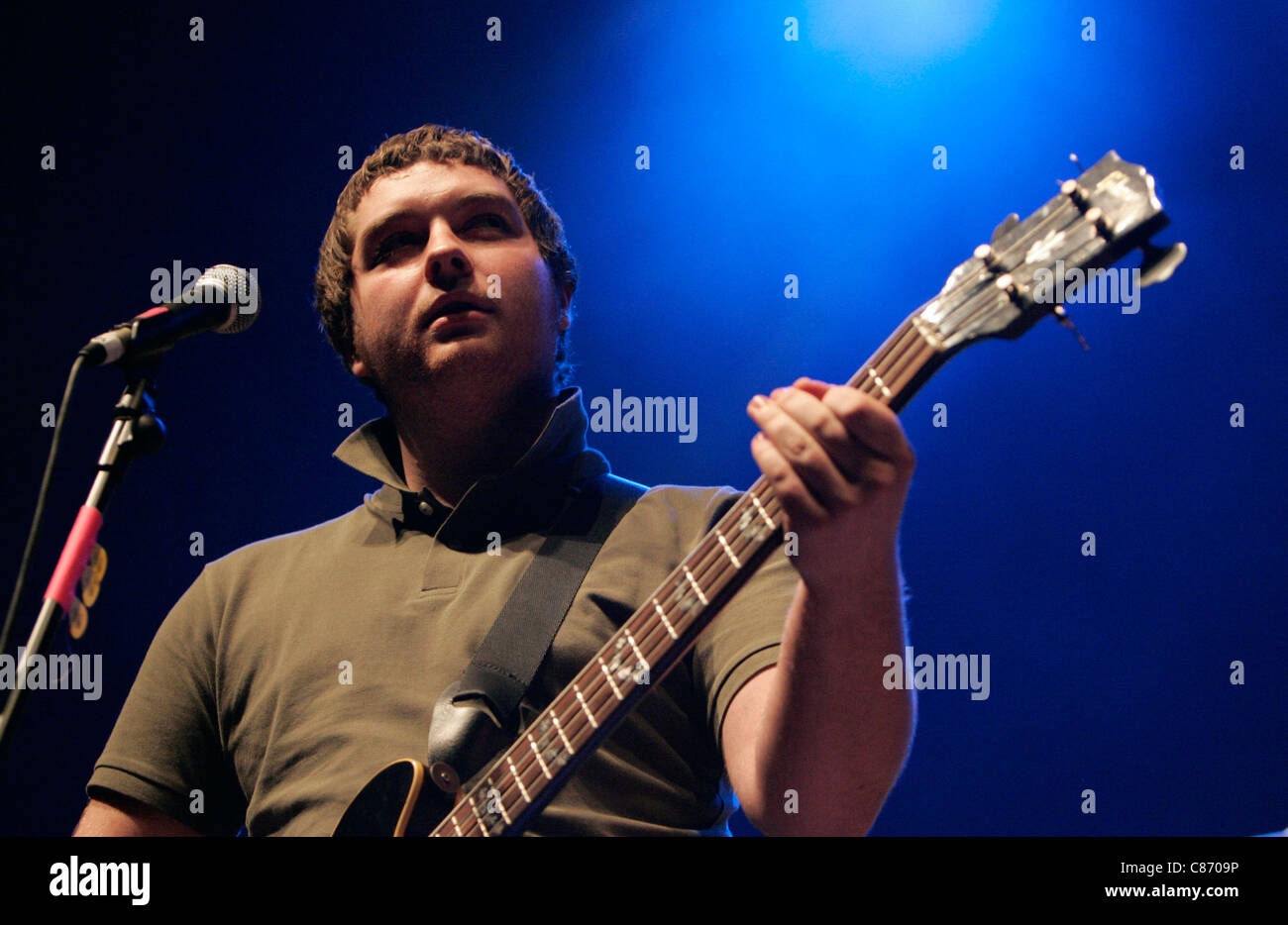 Andy Nicholson, bass guitar with the Arctic Monkeys performs on stage ...
