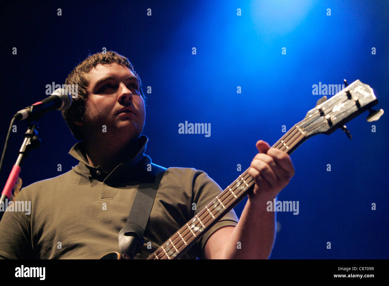 Andy Nicholson, bass guitar with the Arctic Monkeys performs on stage ...