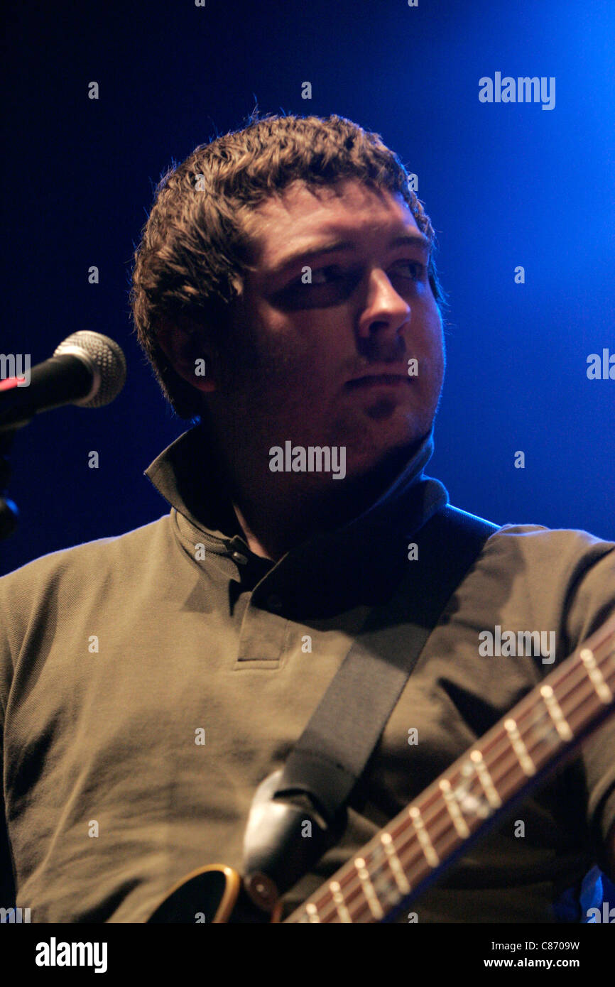 Andy Nicholson, bass guitar with the Arctic Monkeys performs on stage ...