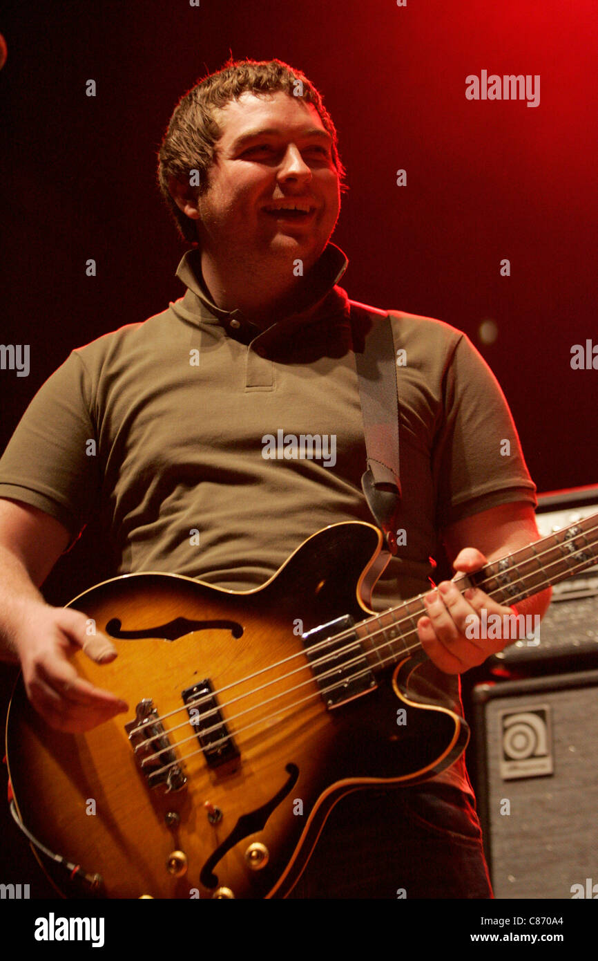 Andy Nicholson, bass guitar with the Arctic Monkeys performs on stage ...