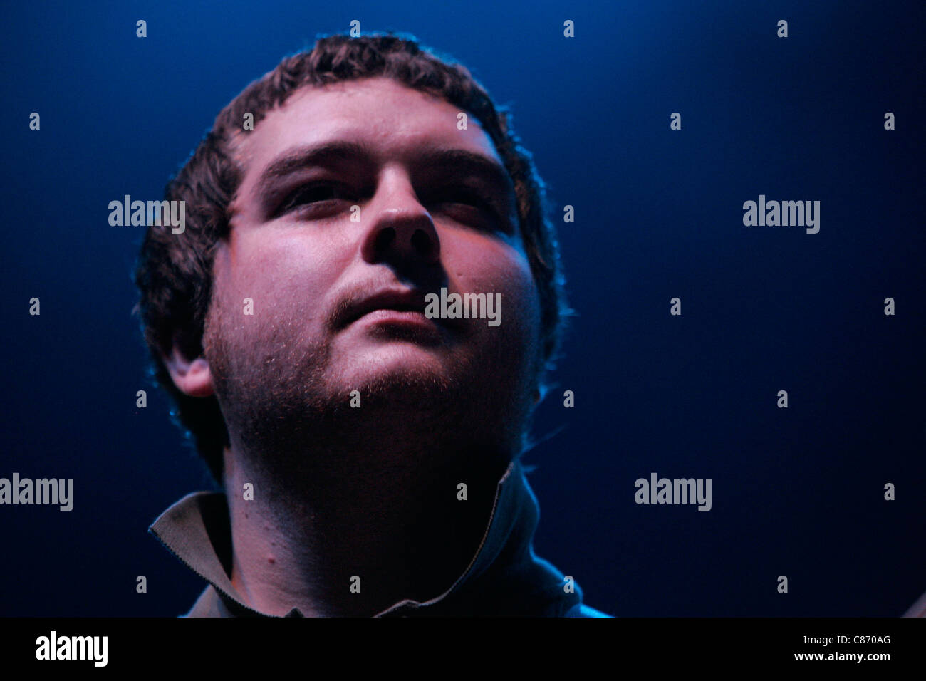 Andy Nicholson, bass guitar with the Arctic Monkeys performs on stage ...