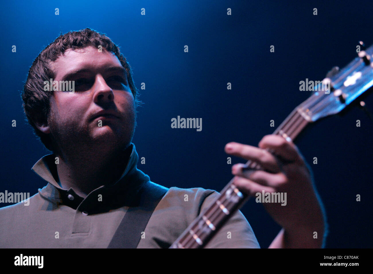 Andy Nicholson, bass guitar with the Arctic Monkeys performs on stage ...