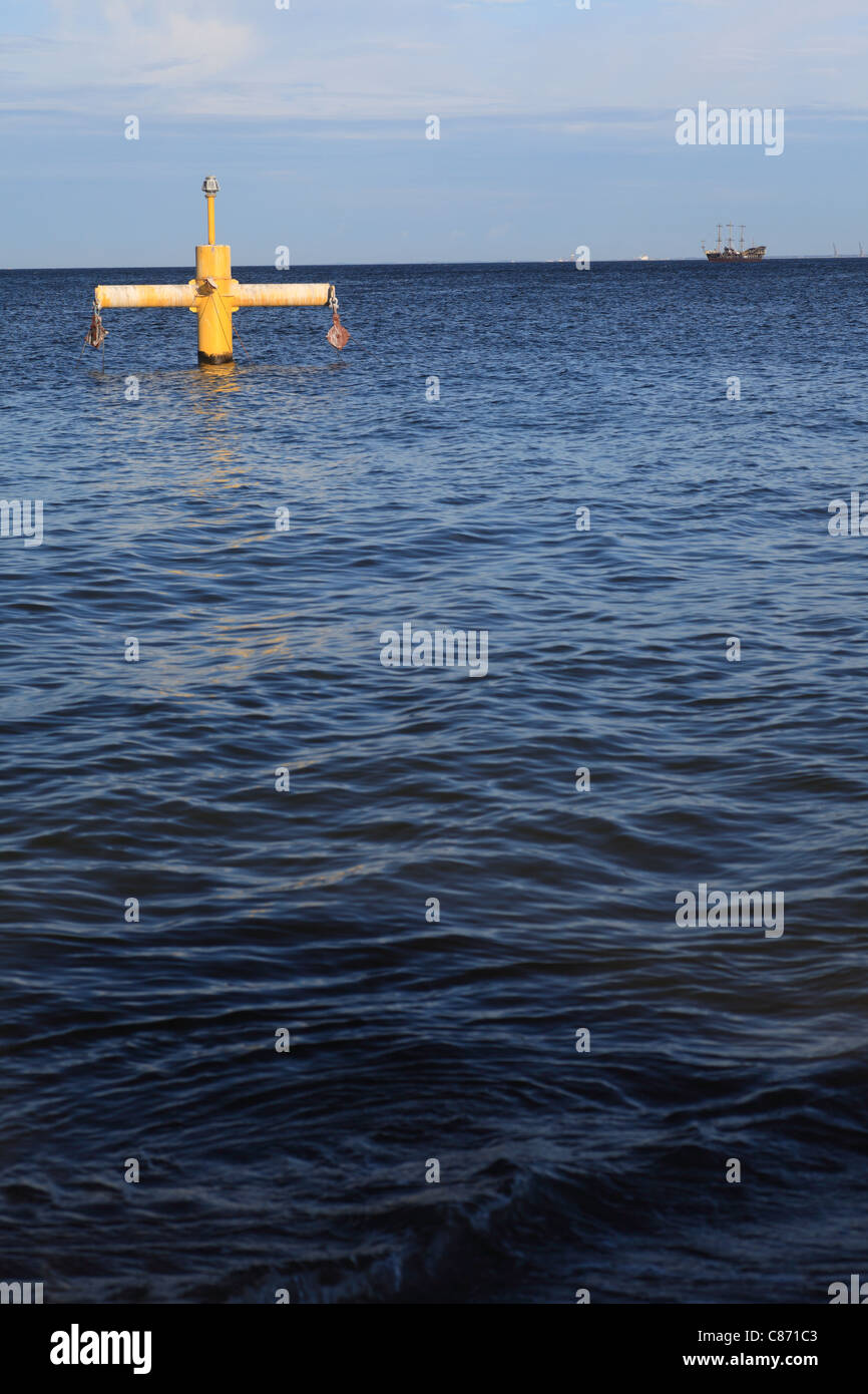 sea yellow device and old ship Stock Photo - Alamy