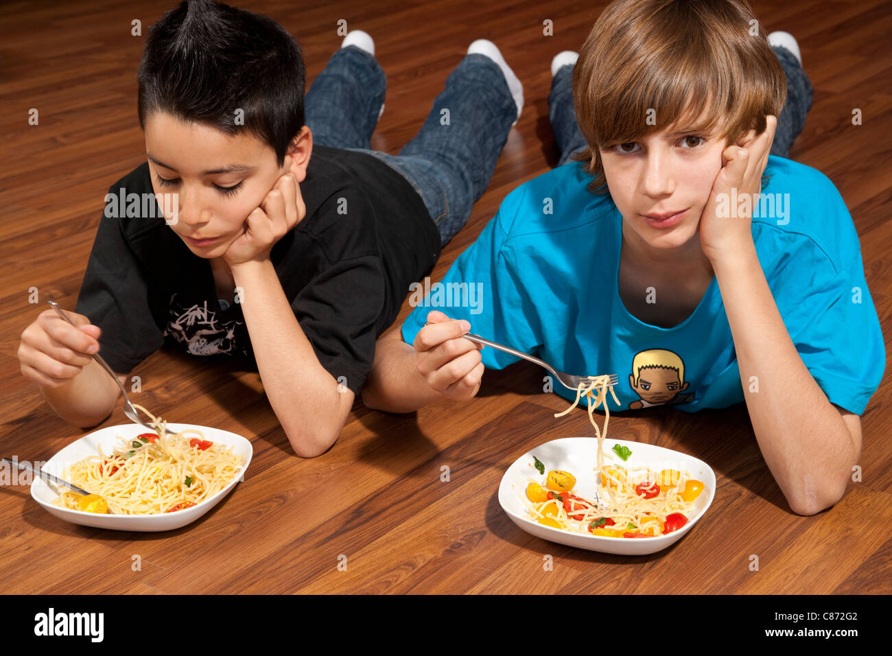 Boys Eating Pasta Stock Photo - Alamy