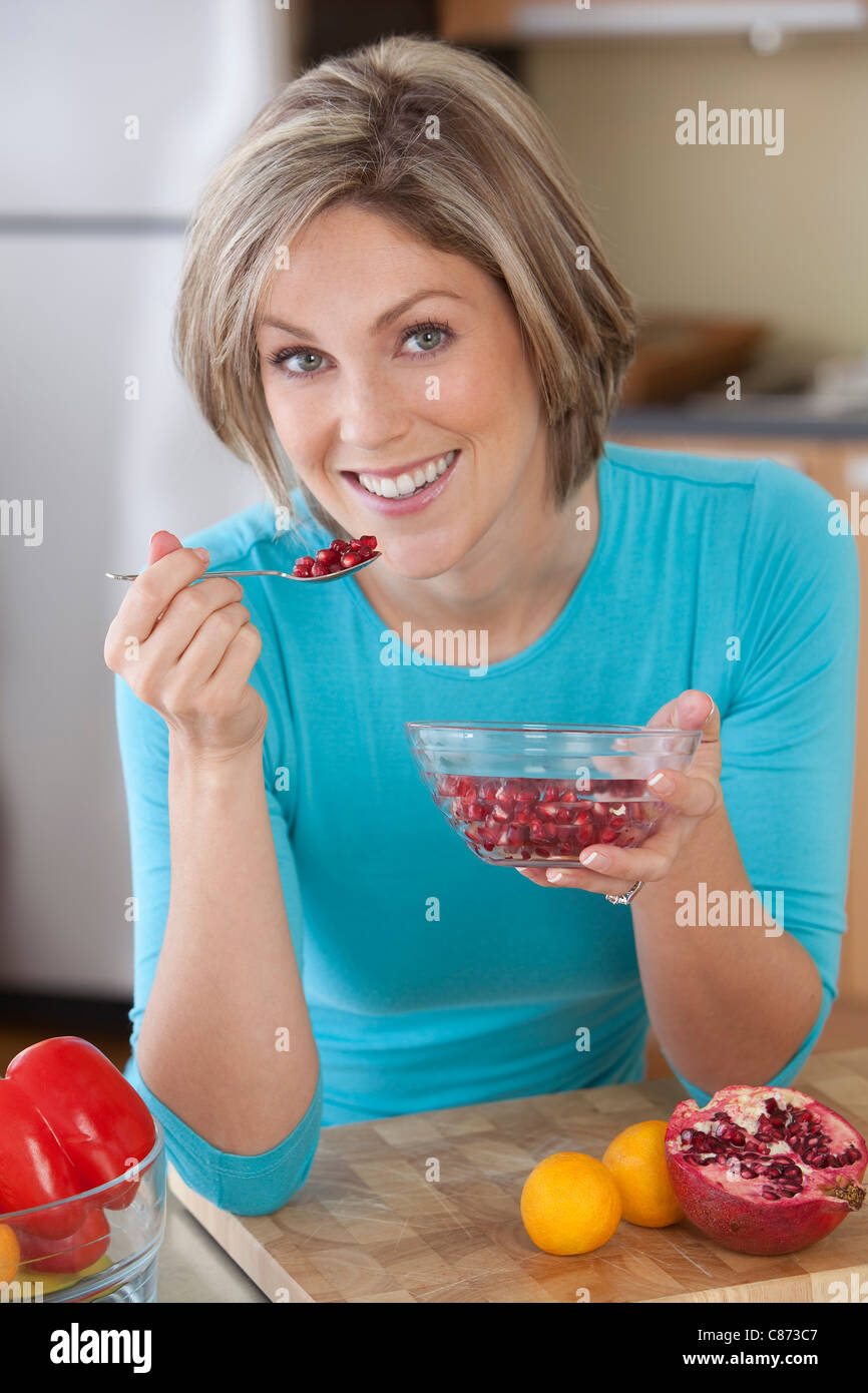 Woman eating Pomegranate Stock Photo - Alamy
