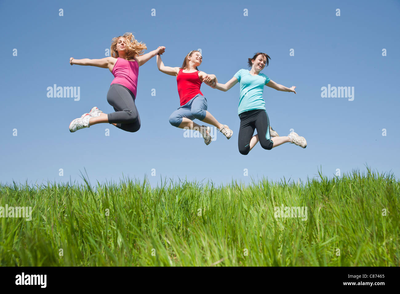 Young Women Jumping Stock Photo - Alamy