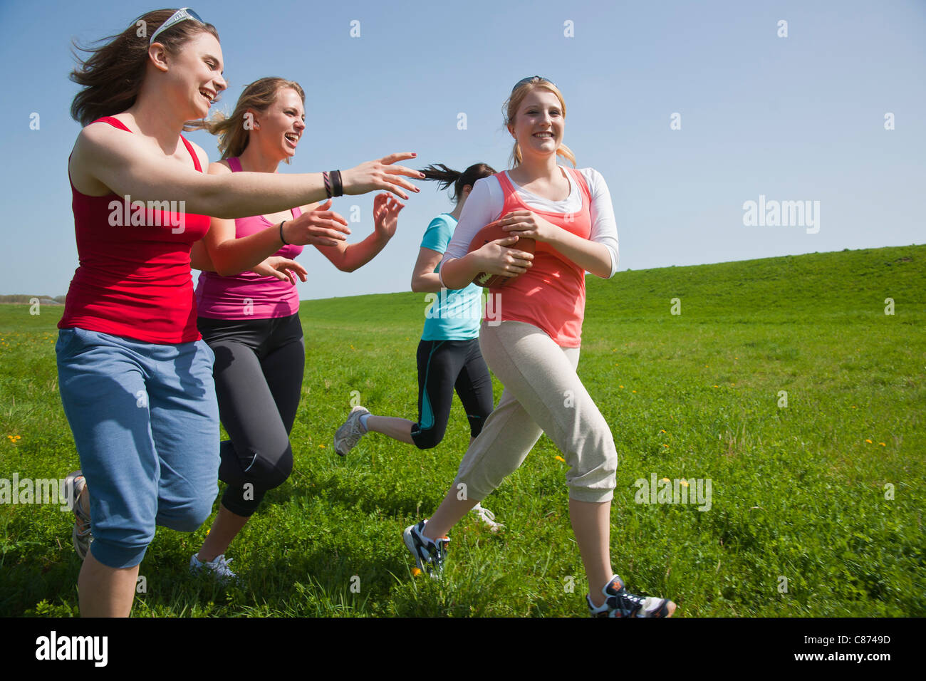 Young Women Playing Football Stock Photo - Alamy