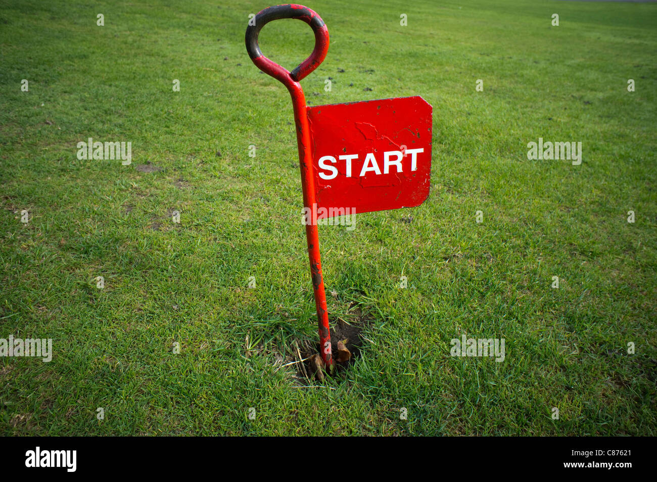 Metal start marker on a small golf pitch Stock Photo - Alamy