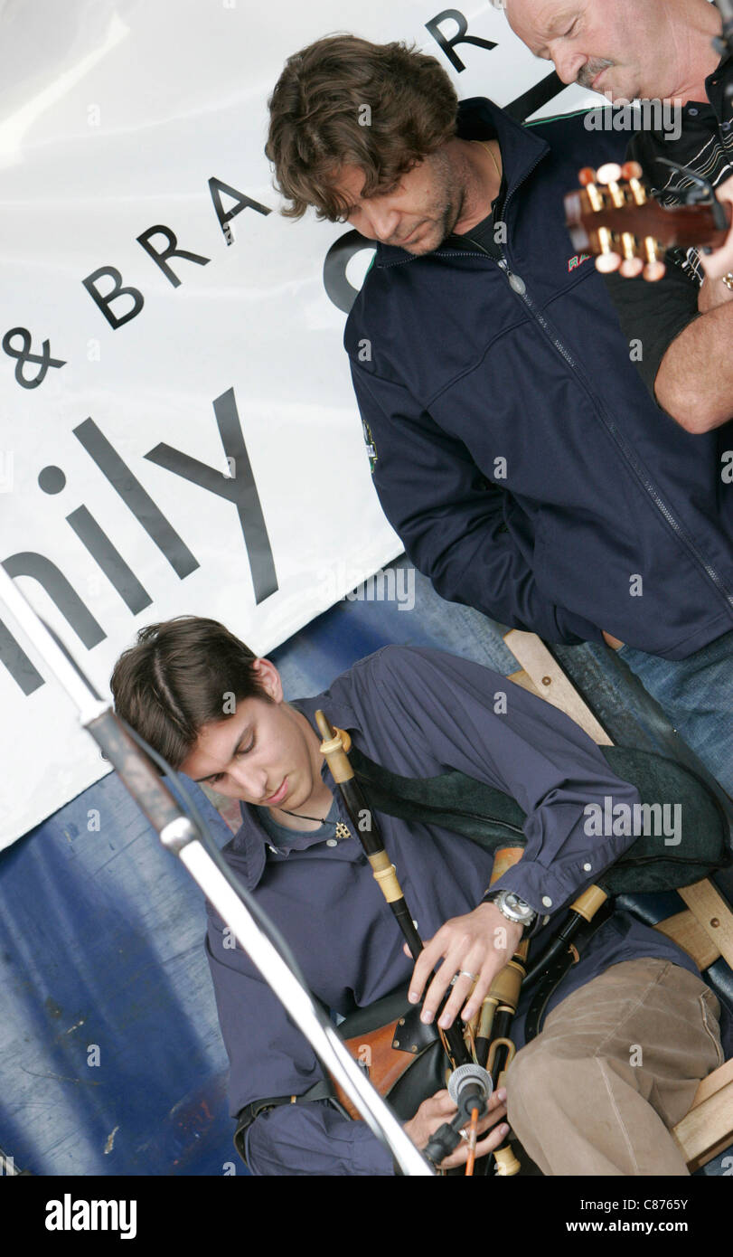 Russell Crowe watches uilleann pipes player on stage Stock Photo - Alamy