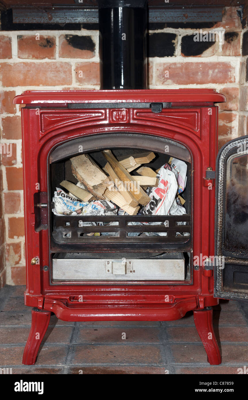 Wood burning fire with sticks and newspaper ready for lighting Stock ...