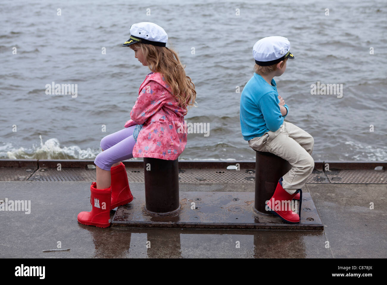 Two young children are playing a domestic quarrel Stock Photo - Alamy